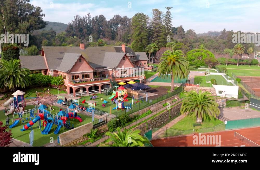 Large mansion with recreational playground for children in a sports ...