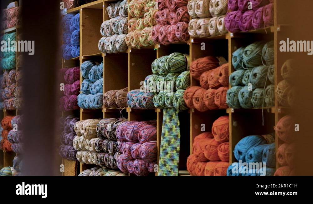 Colorful display of yarn in shelves at fabric store Stock Video Footage ...