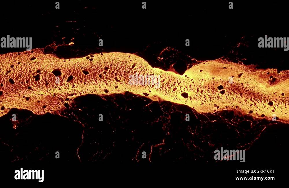 Magma river flowing through basalt rock in earths mantle, top down ...