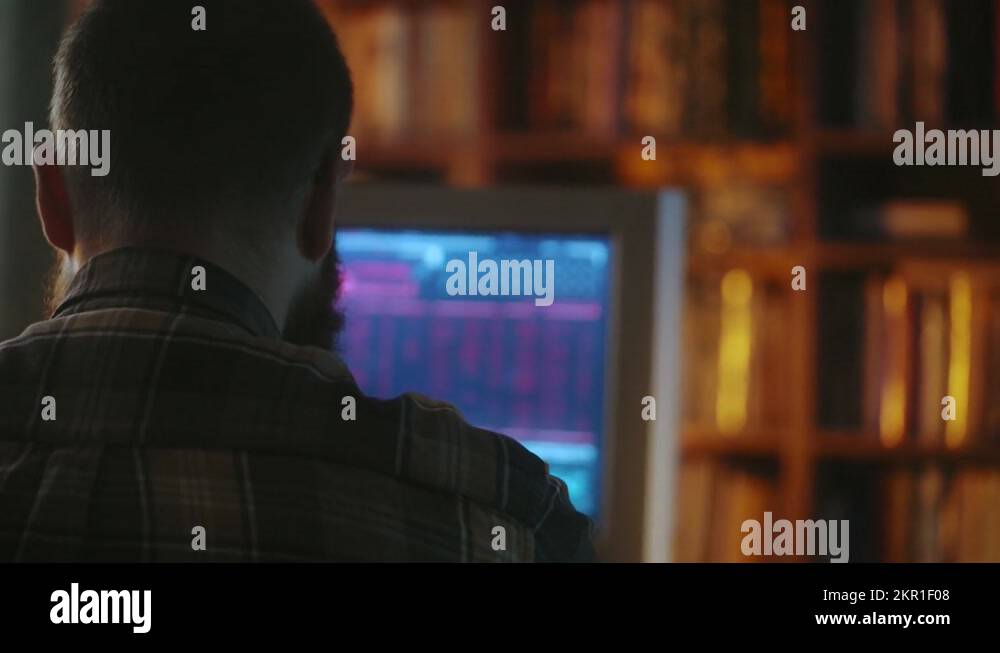 Back view of oldschool programmer looking pc screen, hacker stealing ...