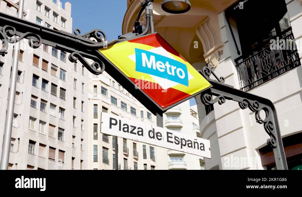 Plaza de España metro station sign with spanish flag and Gran Via ...