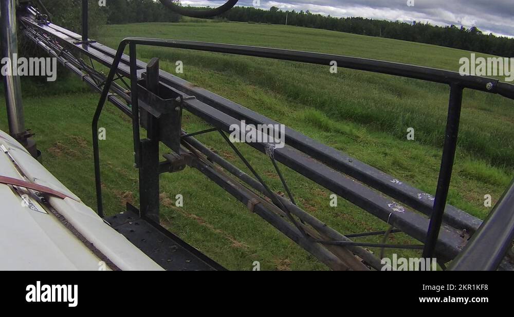 Spray boom lifting out of the transport saddle on a high clearance ...