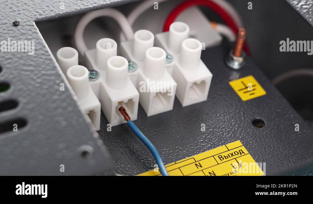 Installation of power wires of conductors in the terminal block Stock ...