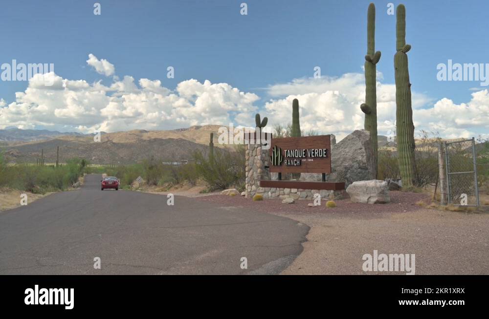 Entrance gate and sign for Tanque Verde Ranch in Tucson. Red car entering Stock Video Footage ...