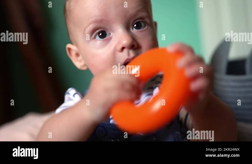 Baby boy chewing on toy Stock Videos & Footage - HD and 4K Video Clips ...