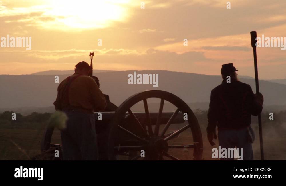 Civil War Confederate Re-enactors FIRE a Cannon in battle at Sunset ...