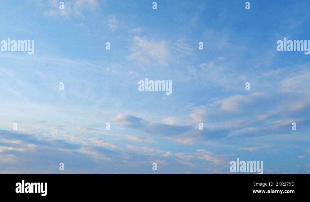 Sky with several layers of clouds moving in different directions. Sun ...