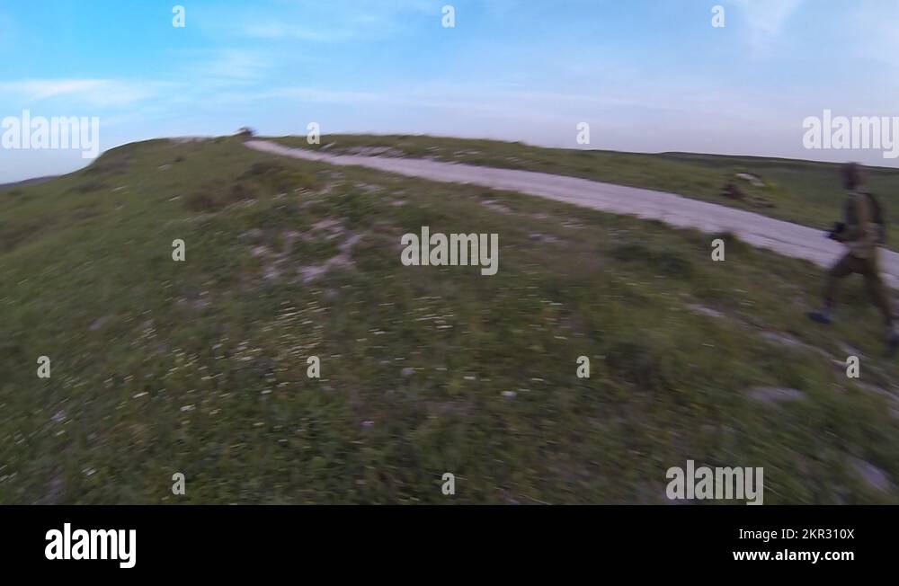 armed soldiers walking through field. soldiers running with Machine gun ...