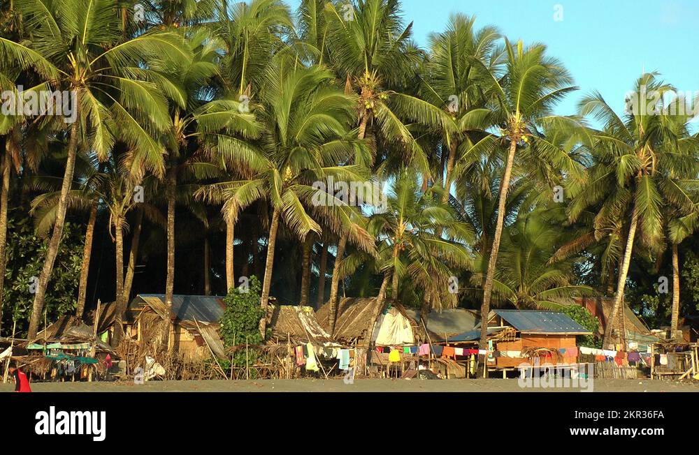 Poor peoples housing along a beach in the Philippines Stock Video ...