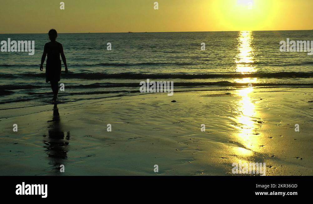 Filipino Woman walking on Datu Sumakwel Beach in the Philippines Stock ...