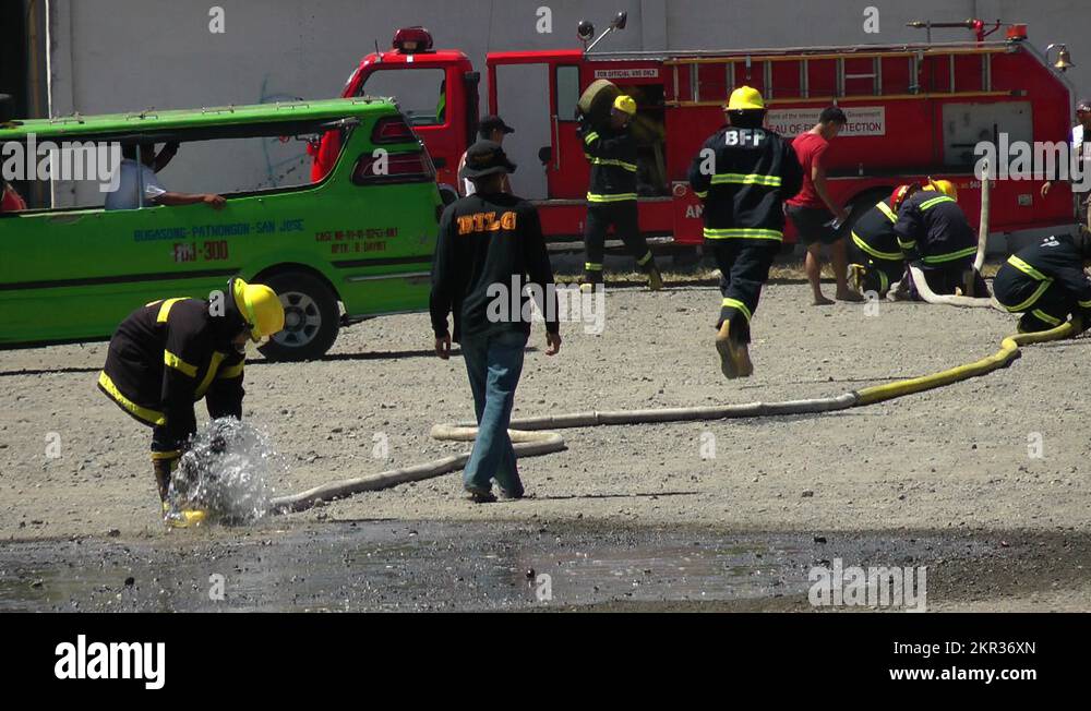Fire fighters training under the hot sun in the Philippines Stock Video ...