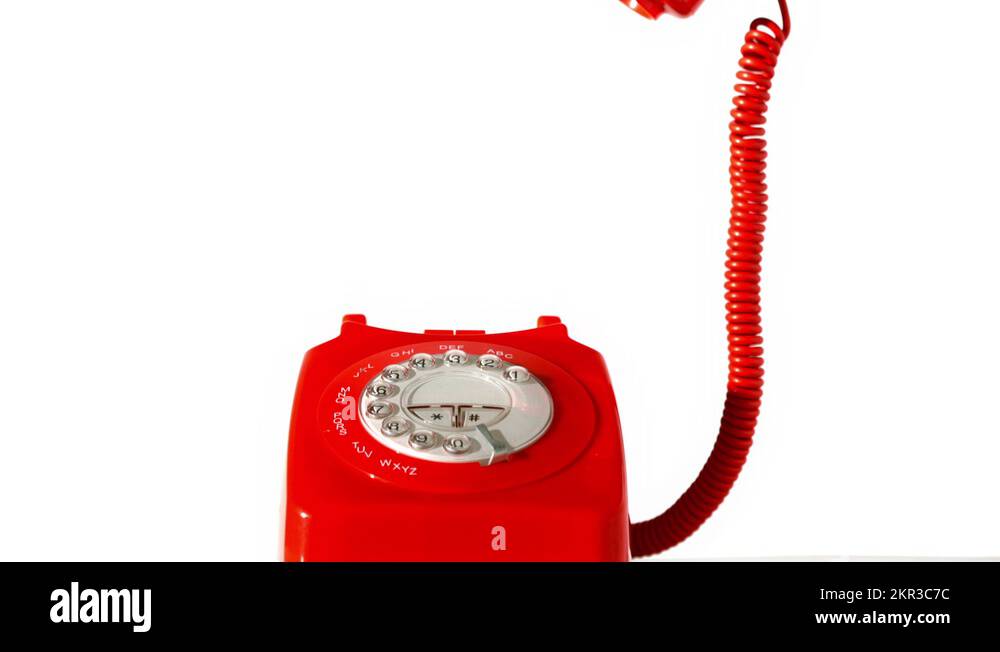 Receiver falling onto red dial phone on white background Stock Video ...