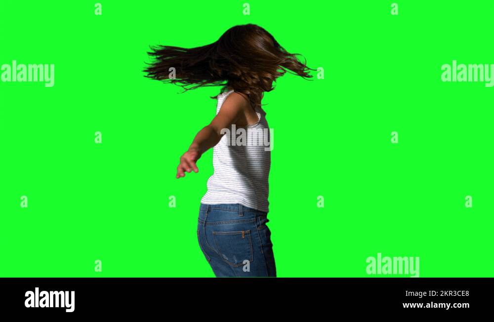 Little girl spinning around on green screen Stock Video Footage - Alamy