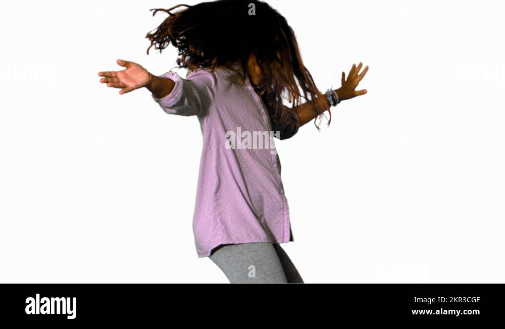 Little girl jumping and turning on white background Stock Video Footage ...