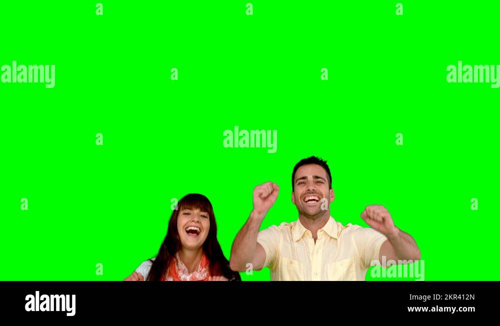 Two friends jumping on green screen Stock Video Footage - Alamy