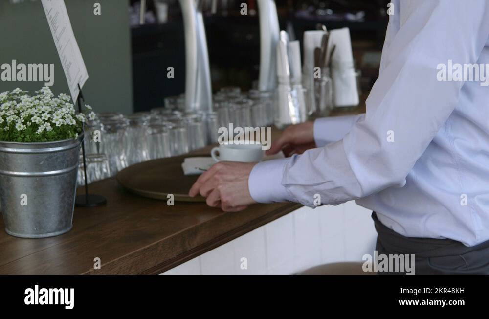 Waiter carrying tray Stock Videos & Footage - HD and 4K Video Clips - Alamy