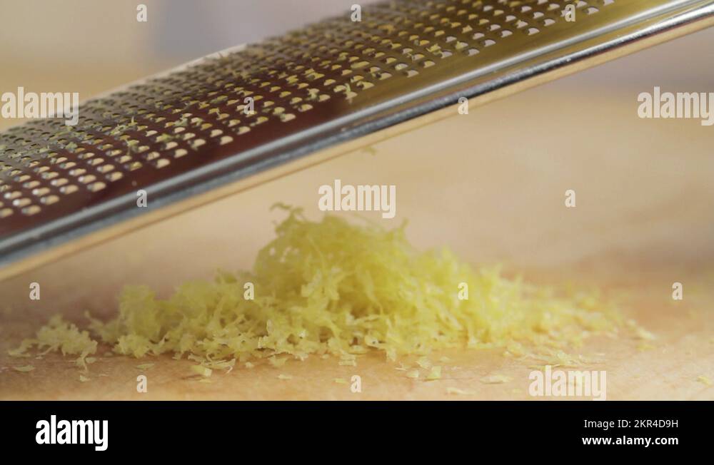 Grating lemon peel Stock Video Footage - Alamy