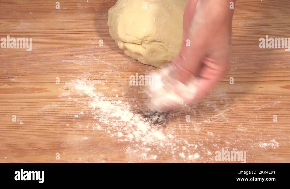 The work surface being dusted with flour for the dough to be kneaded ...