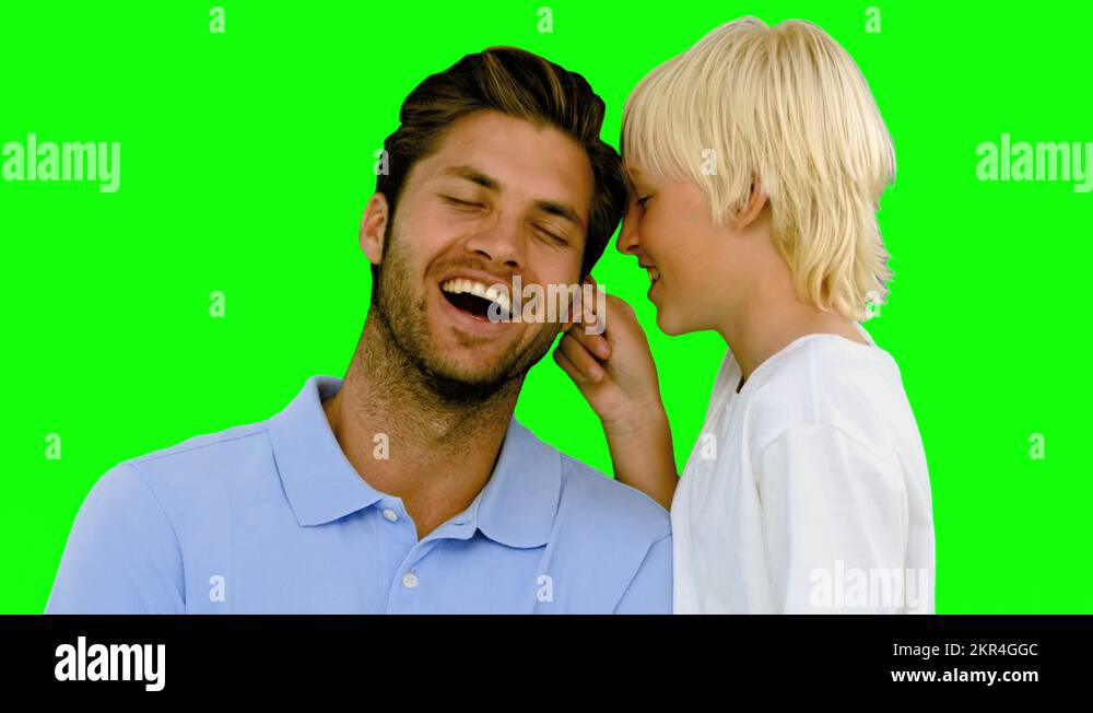 Son pinching the ear of his father on green screen Stock Video Footage ...