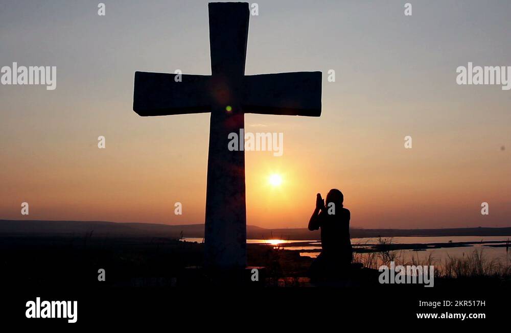 Man cross praying under Stock Videos & Footage - HD and 4K Video Clips ...