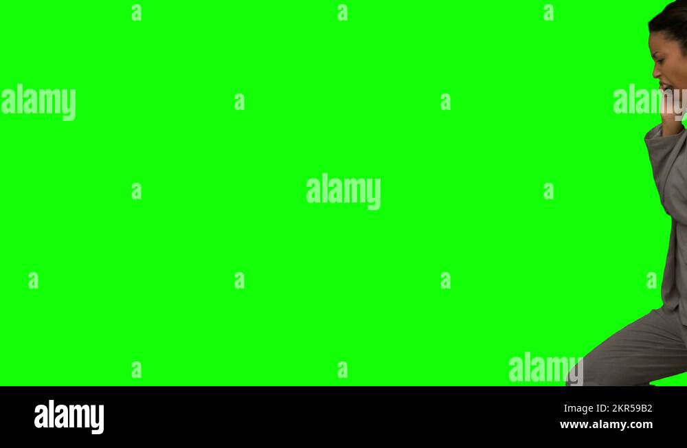 Angry woman shouting at her phone on green screen Stock Video Footage ...