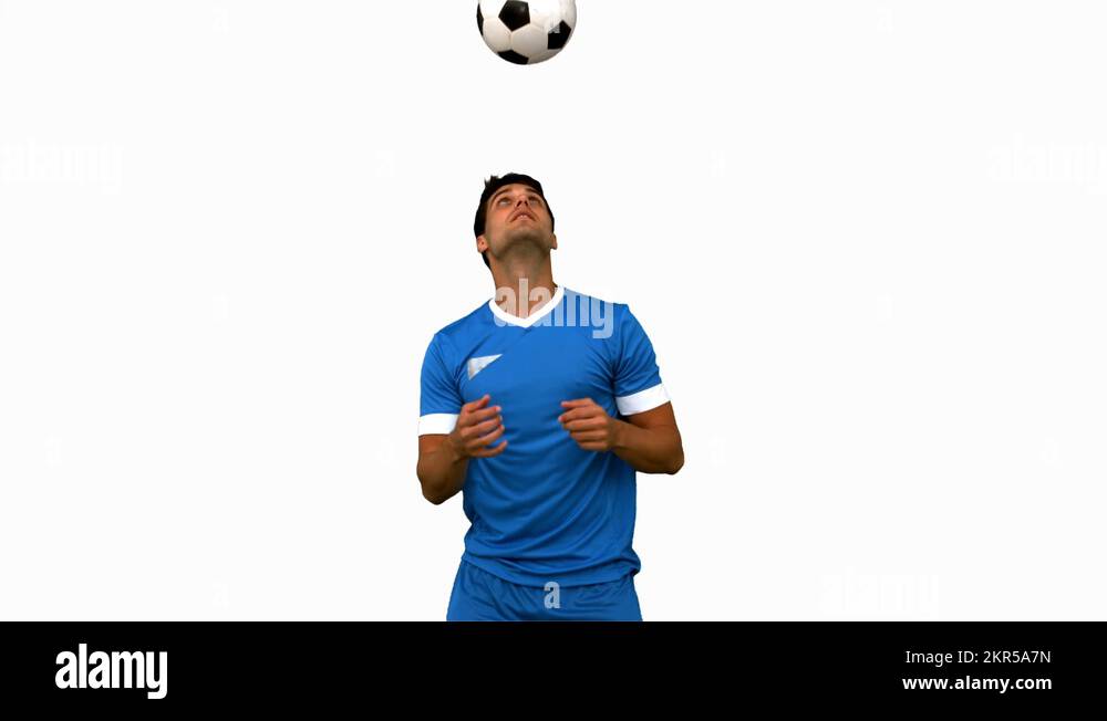 Man juggling a football with head on white screen Stock Video Footage ...