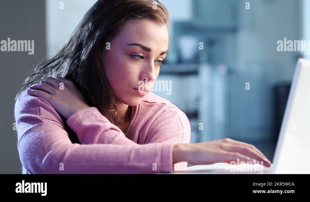 Sad depressed teenage girl using laptop Stock Video Footage - Alamy