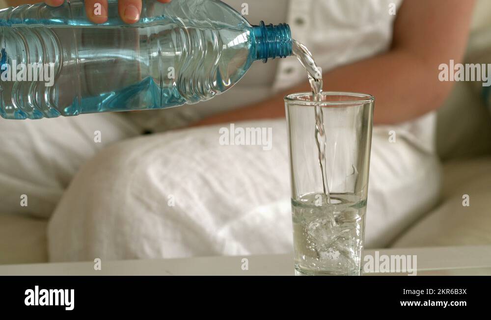 Young woman pouring water glass Stock Videos & Footage - HD and 4K Video Clips - Alamy