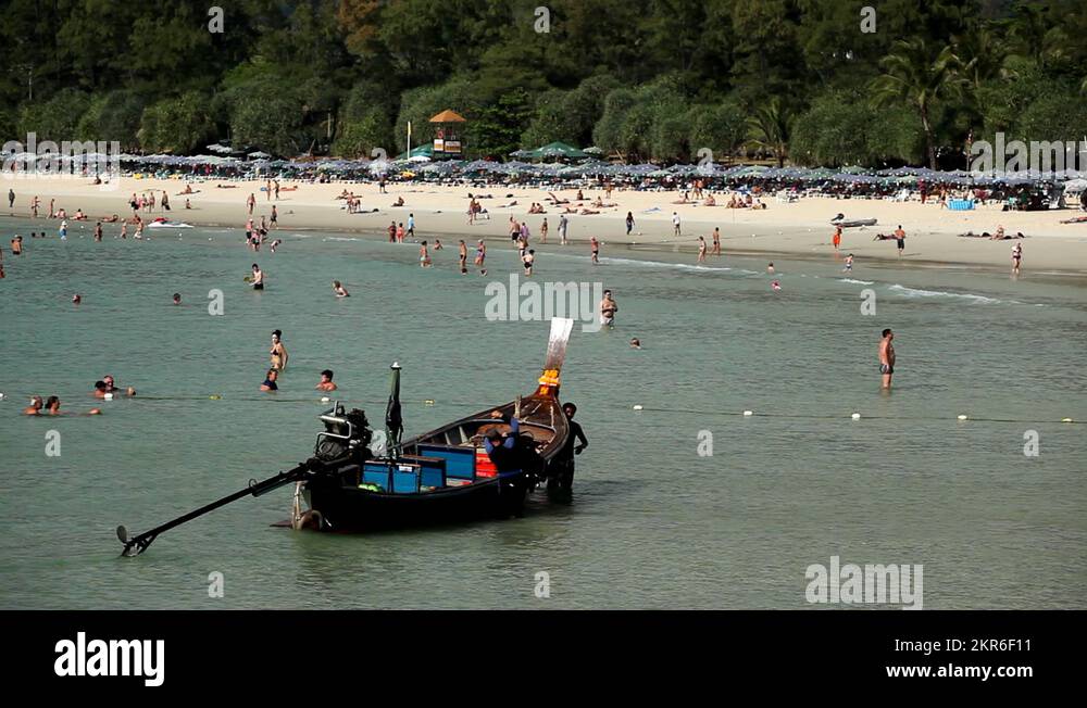 People on crowded beach on their swimming suits, sunbathing, crowd ...