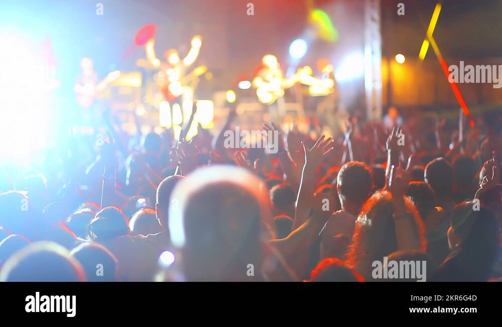 Large crowd of young people dancing at the rock 'n roll concert Stock ...