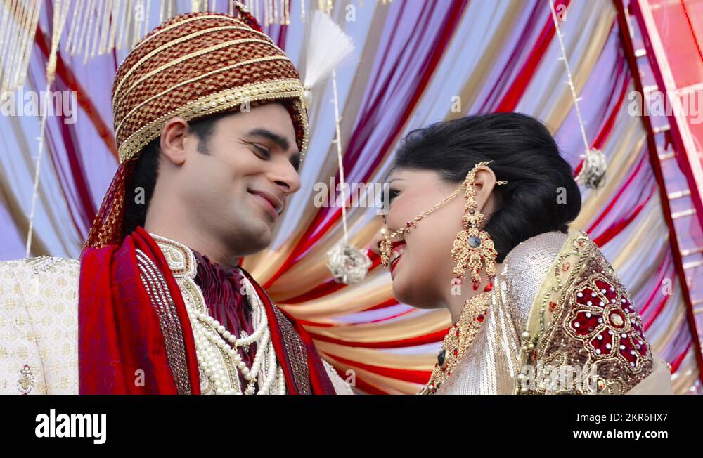 Indian bride and groom in traditional wedding dress talking to each other Stock Video Footage ...