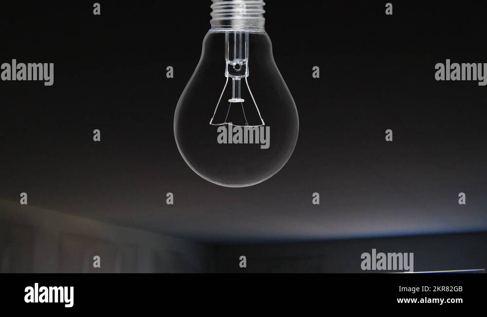 Lightbulb energy animation on black background with glowing planet ...