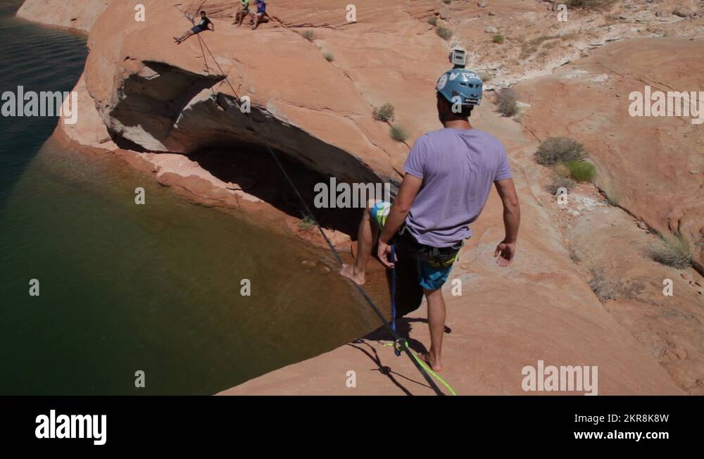 WS HA Man walking on tight-rope and falling / Lake Powell, Utah, USA ...