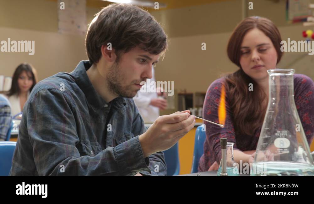 A pair of university students do a chemistry experiment in class Stock ...