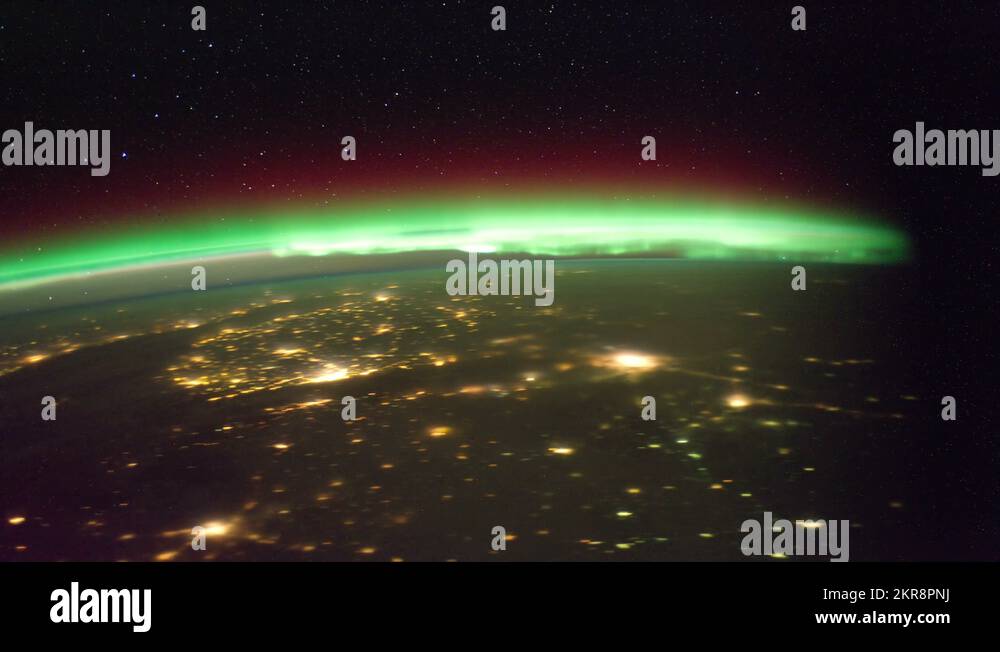 ISS (International Space Station) orbiting earth with visible aurora ...
