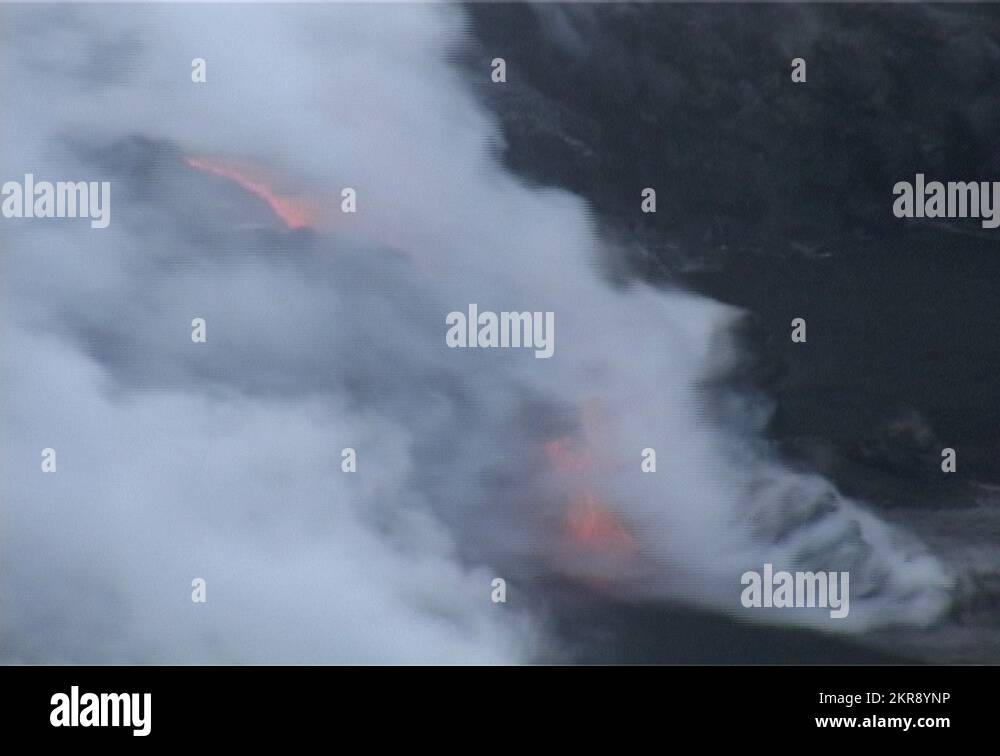 Ocean waves crash onto a lava flow as an island is formed in Stock ...