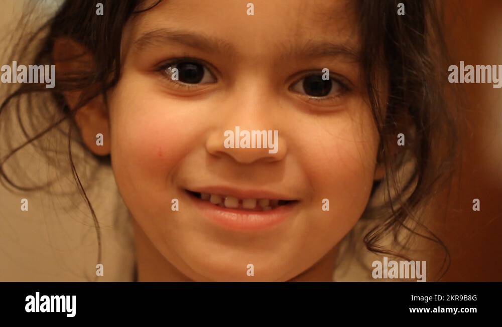 little Girl wiggles her first loose tooth Stock Video Footage - Alamy