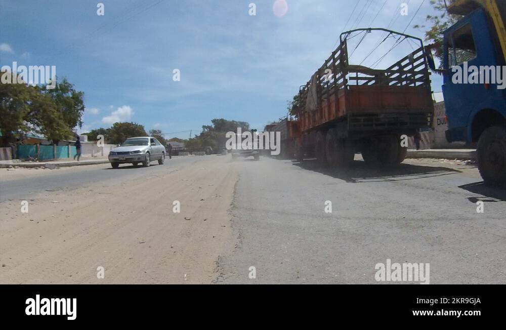 Mogadishu, Somalia, Circa 2013: A long line of trucks parked along a ...