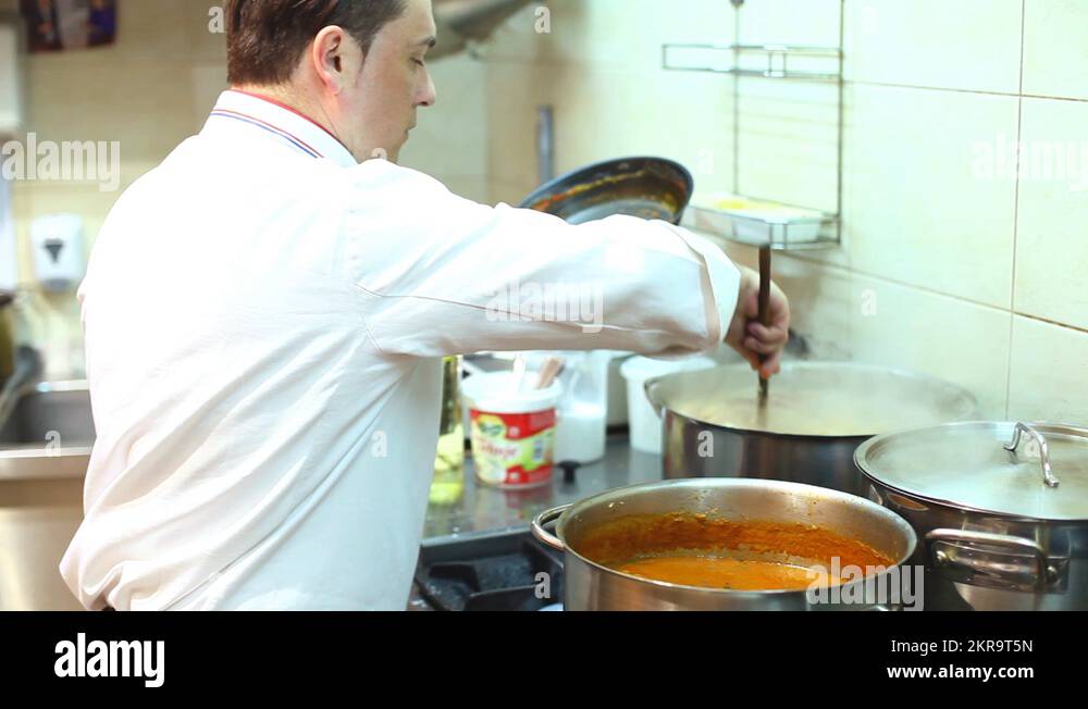 Chef cooking in restaurant kitchen Stock Video Footage - Alamy