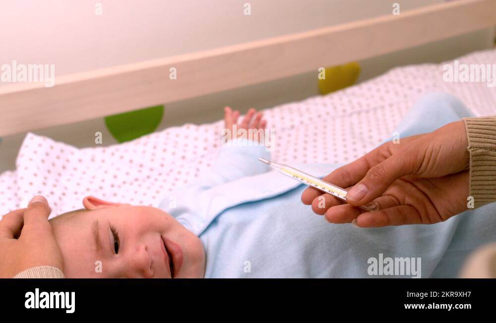 Mother taking baby temperature Stock Videos & Footage - HD and 4K Video ...