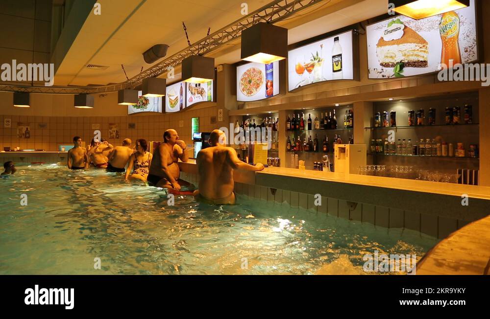 People near bar inside water park Stock Video Footage - Alamy