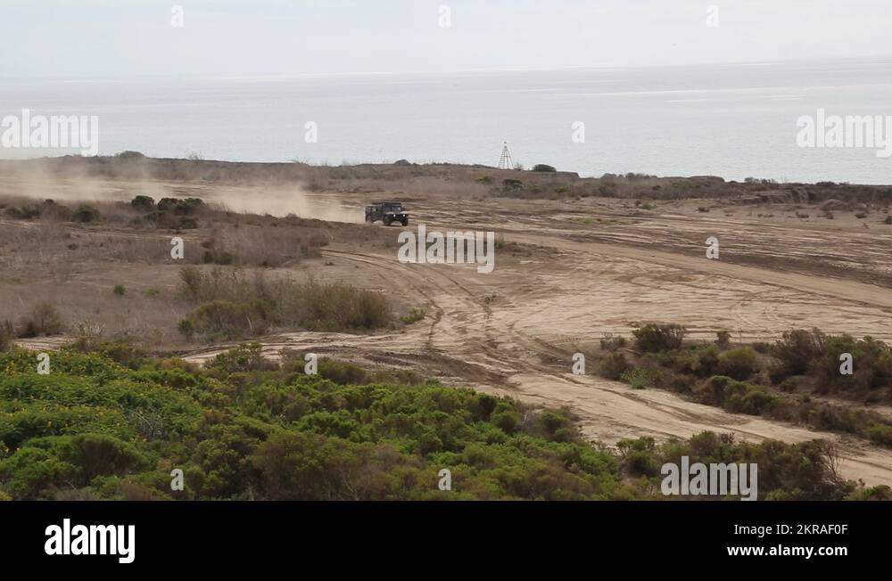 green military humvee leaves trail of dust (HD Stock Video Footage - Alamy