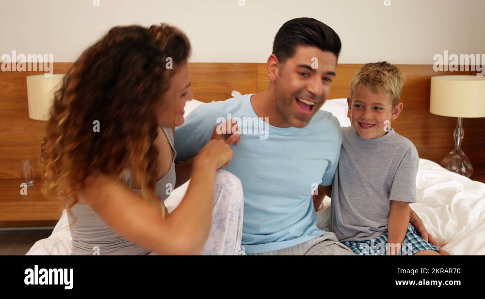 Mother and son tickling father on bed Stock Video Footage - Alamy Mother and son tickling father on bed Stock Video Footage - Alamy
