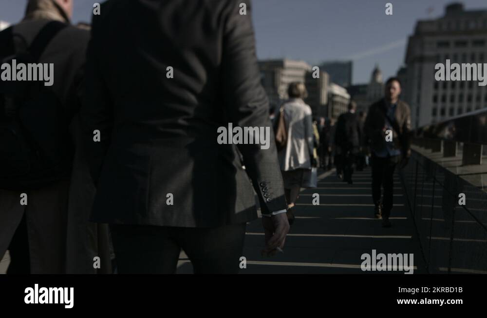 Large crowd of pedestrians walk over London Bridge 46b. HD version ...
