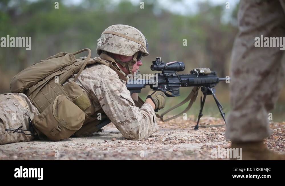 Army soldier work with ammunition magazine on firing range at training ...