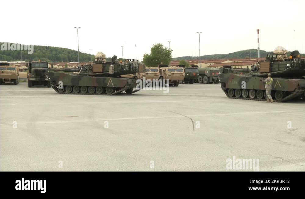 us army abrams tank guided by soldier to back into place Stock Video ...