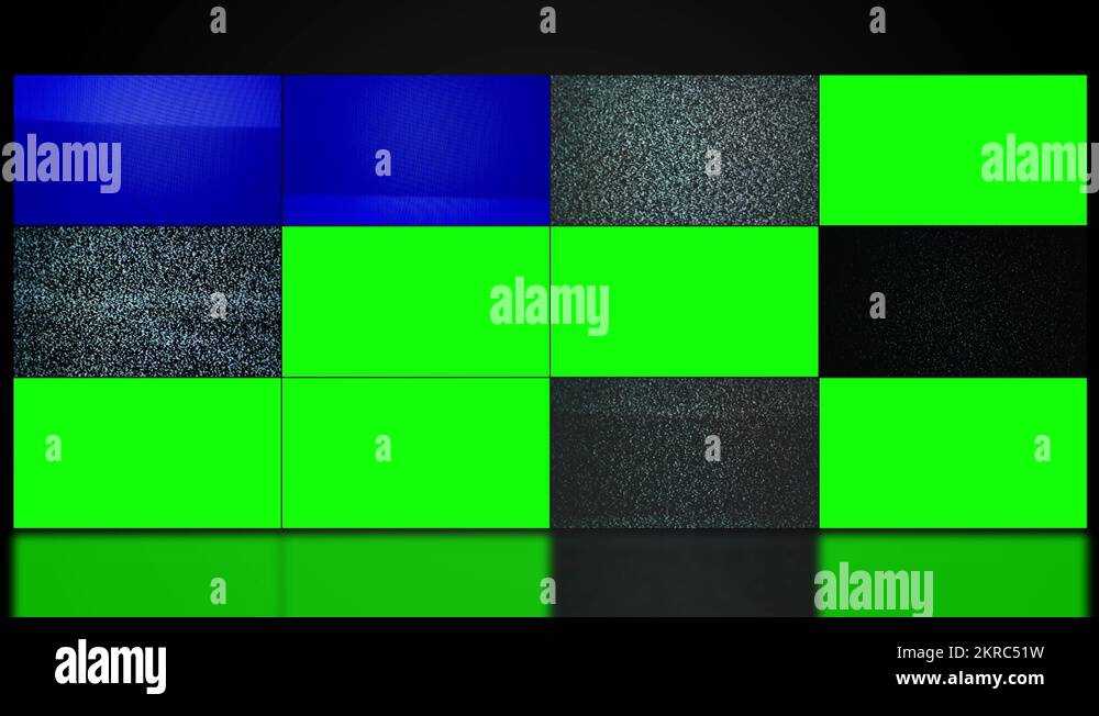 TV video wall displaying noise and changing to green screen Stock Video ...