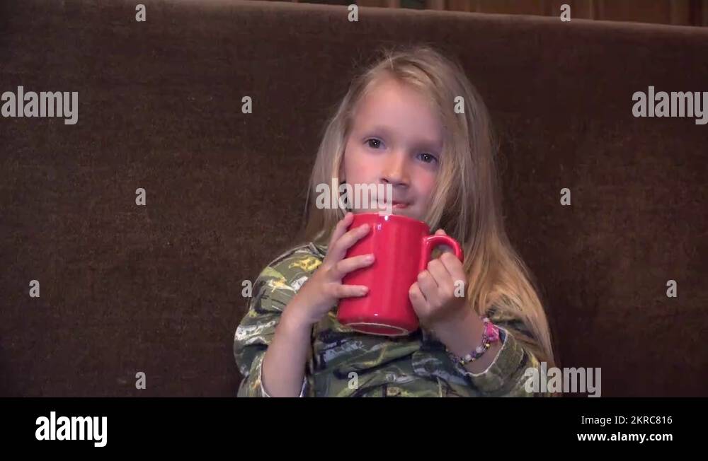 Ultra HD 4K Child Watching TV, Girl Drinking Tea Cup on Bed, Coach ...