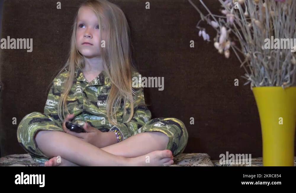 Ultra HD 4K Child Watching TV, Sleepy Little Girl Lying on Bed, Coach ...