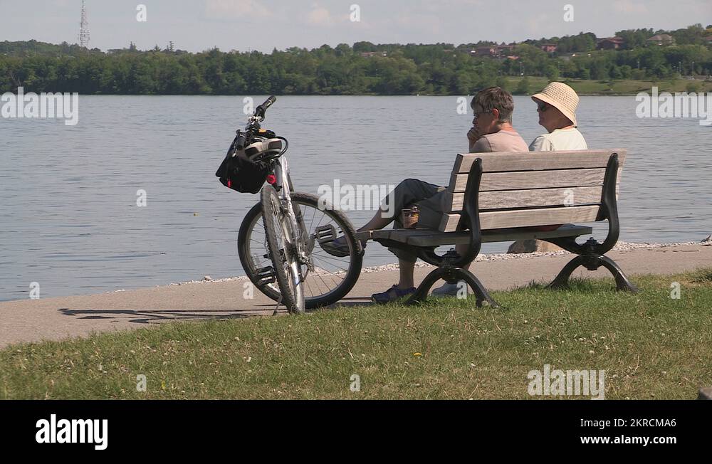 People sitting on park bench Stock Videos & Footage - HD and 4K Video ...